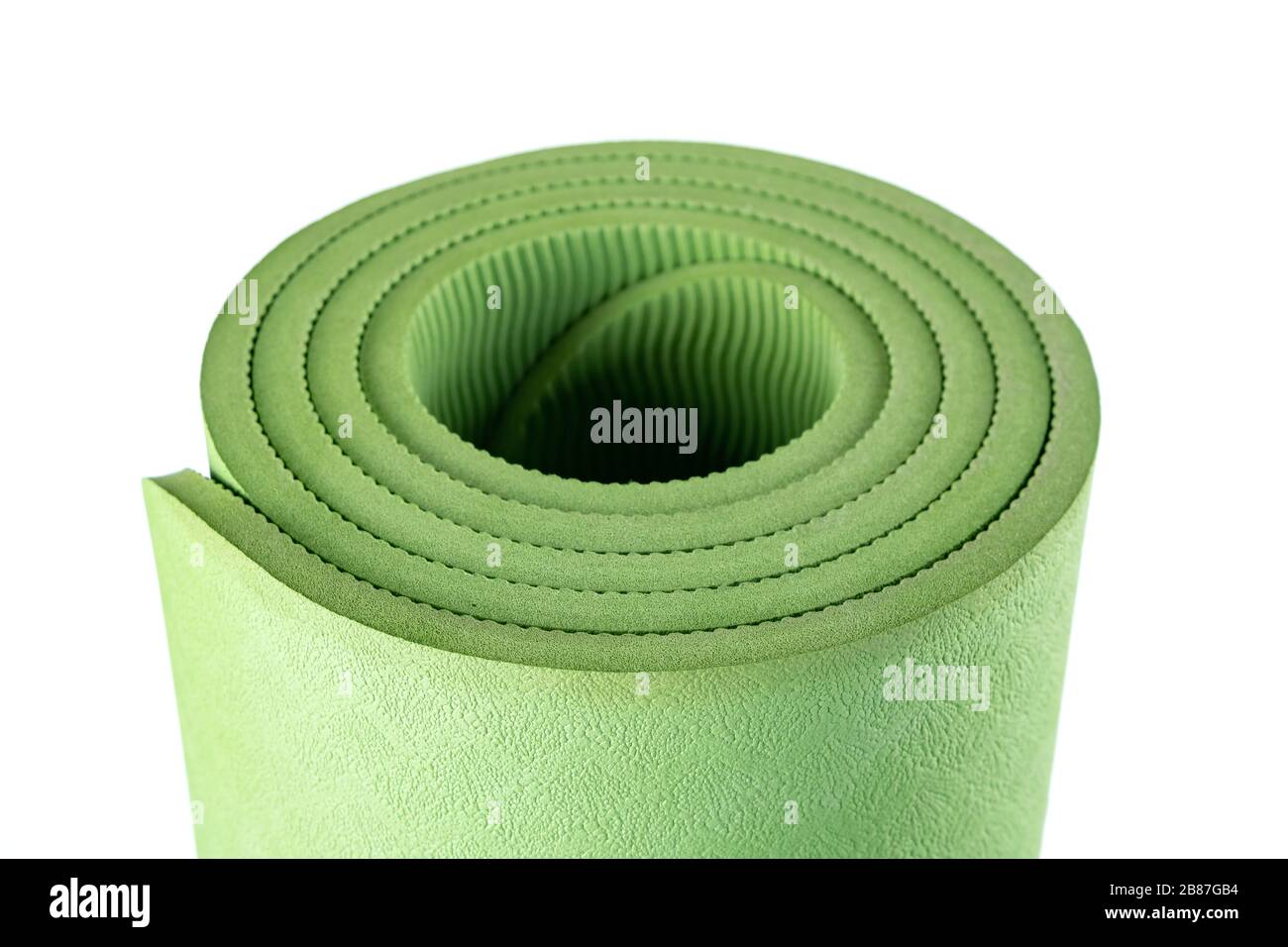 Green rolled sleeping mat isolated on white background Stock Photo - Alamy