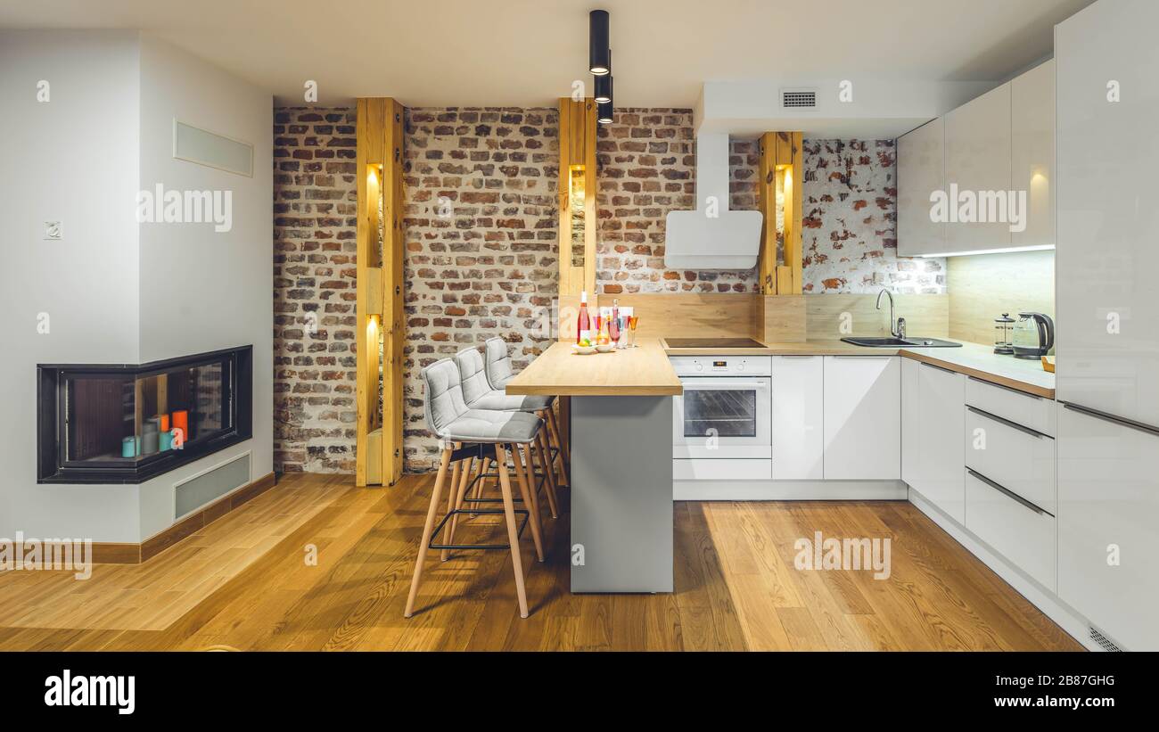 Modern contemporary loft interior of kitchen in studio apartment. Brick ...