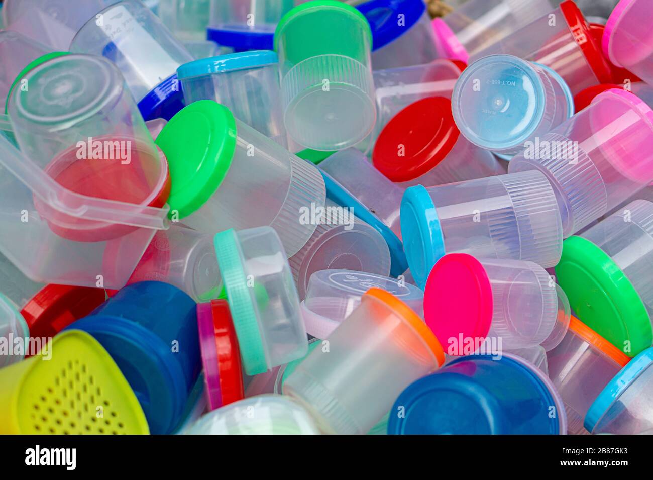 Pile of plastic food containers result of massive industrial production ...