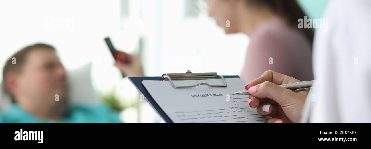Doctor writing appointment Stock Photo - Alamy