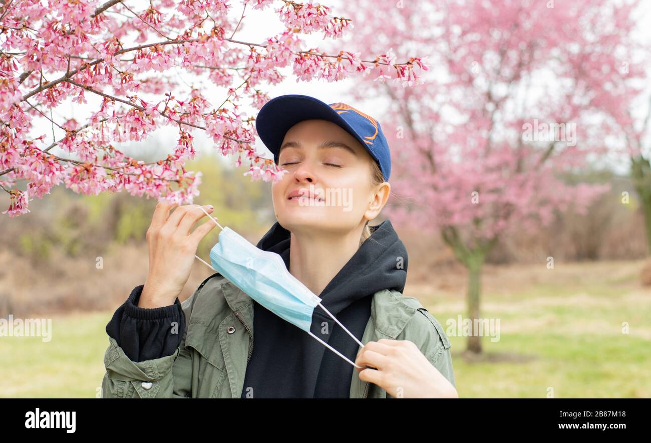 Woman takes off medical mask hi-res stock photography and images - Alamy