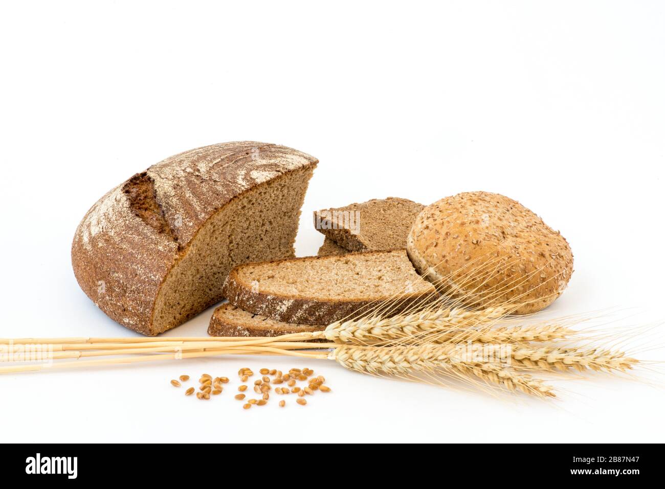 Variety of bread and stalks of wheat isolated on white Stock Photo - Alamy