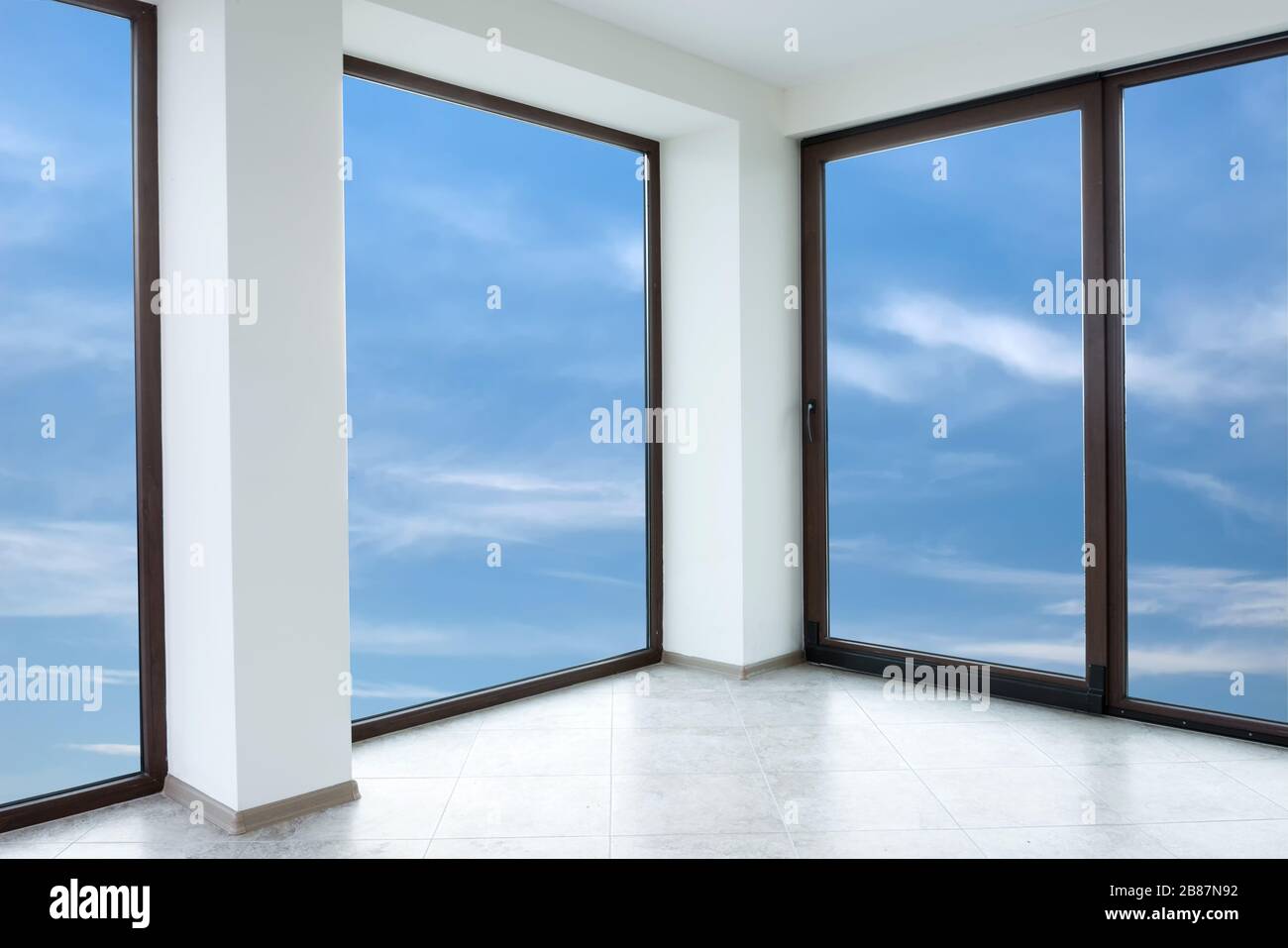 Empty white room with windows (includes clipping path Stock Photo - Alamy