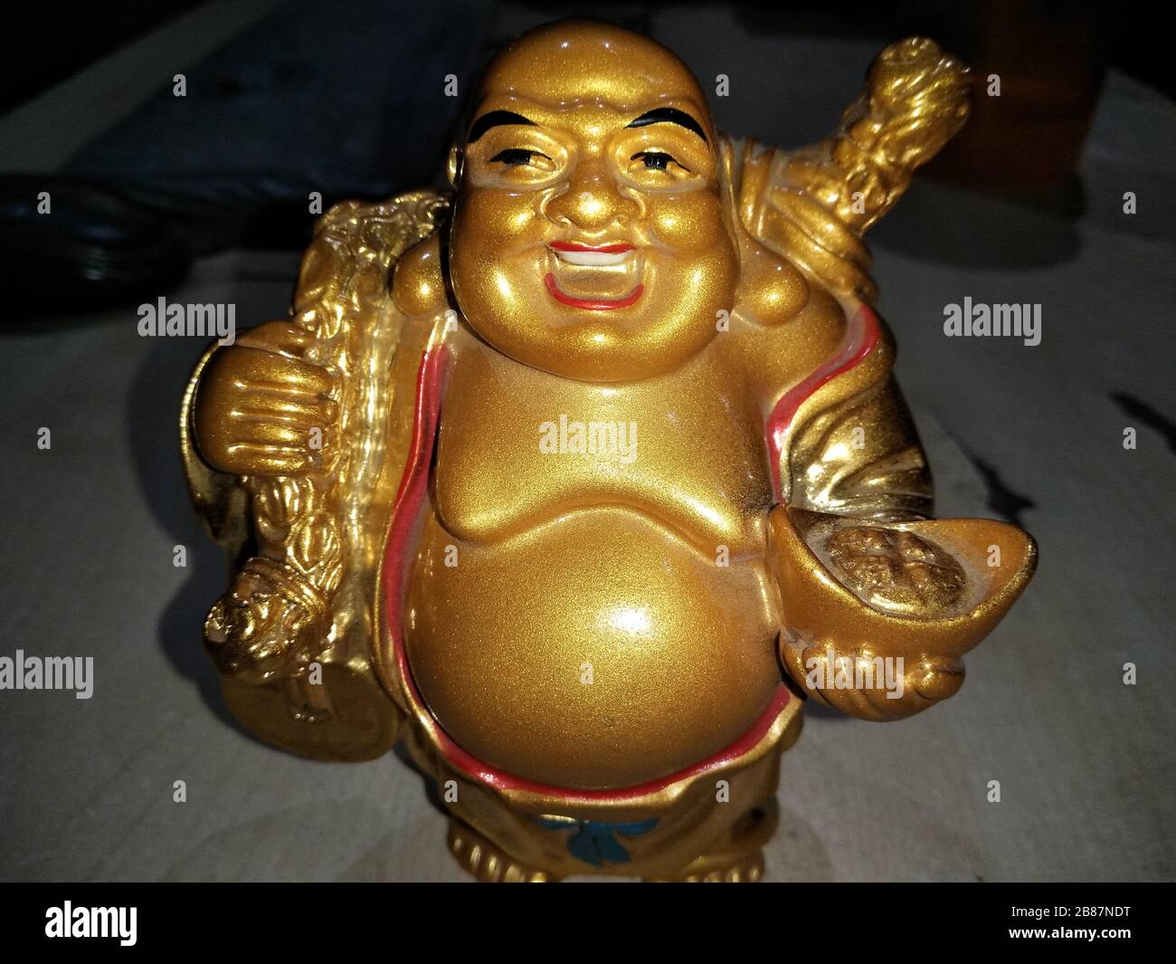 Laughing buddhist monk statue hi-res stock photography and images - Alamy