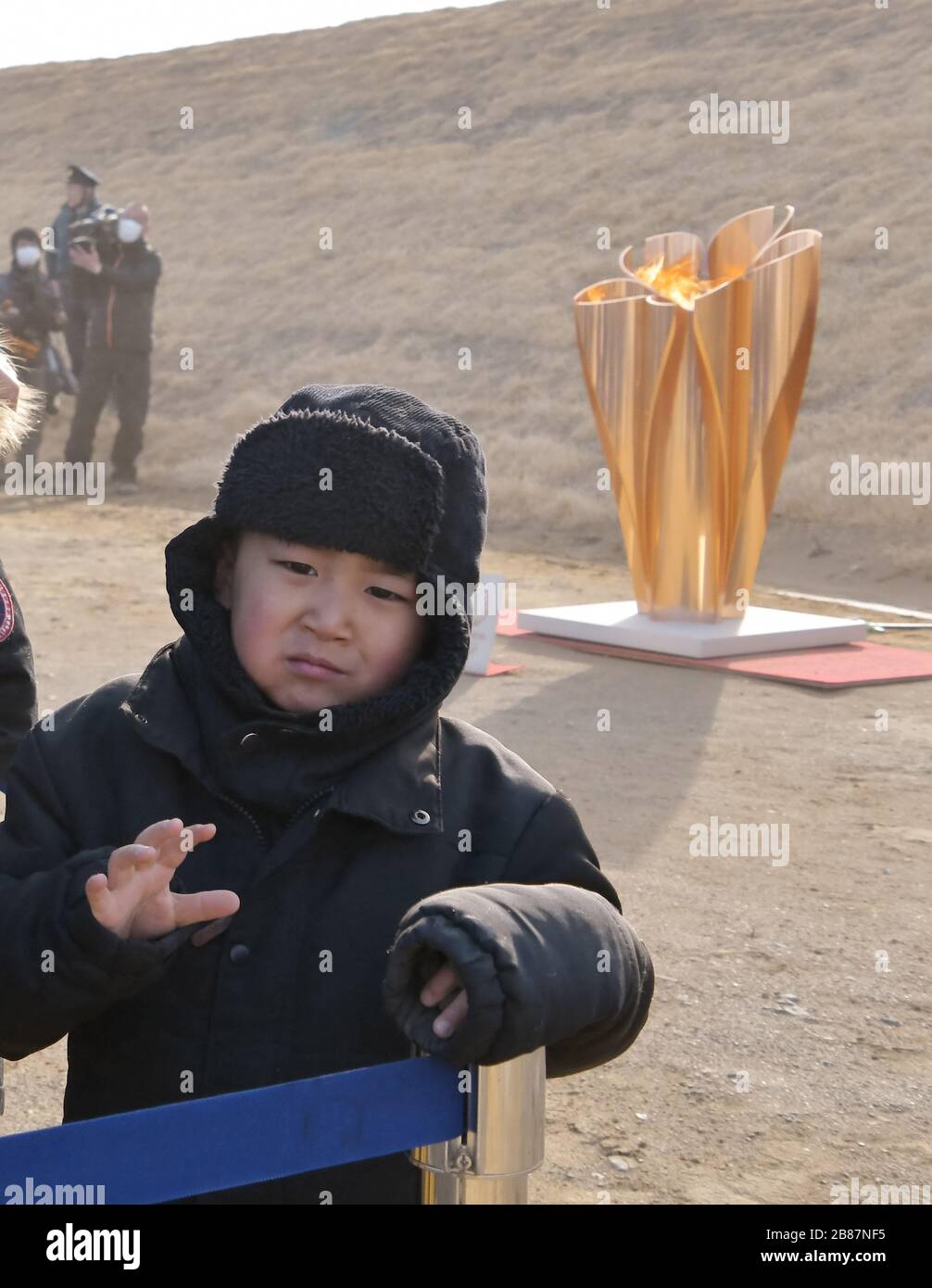 Higashimatsushima, Japan. 20th Mar, 2020. A boy poses for photographers ...