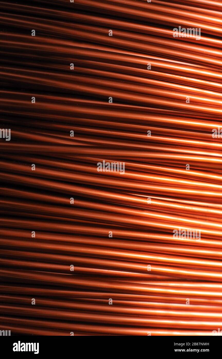 Close-up of a large coil of copper wire in the production of technical ...