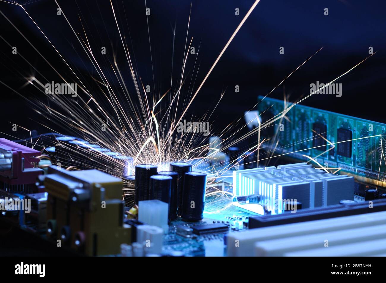 Bright burning sparks fly from the equipment of controller chip. The ...