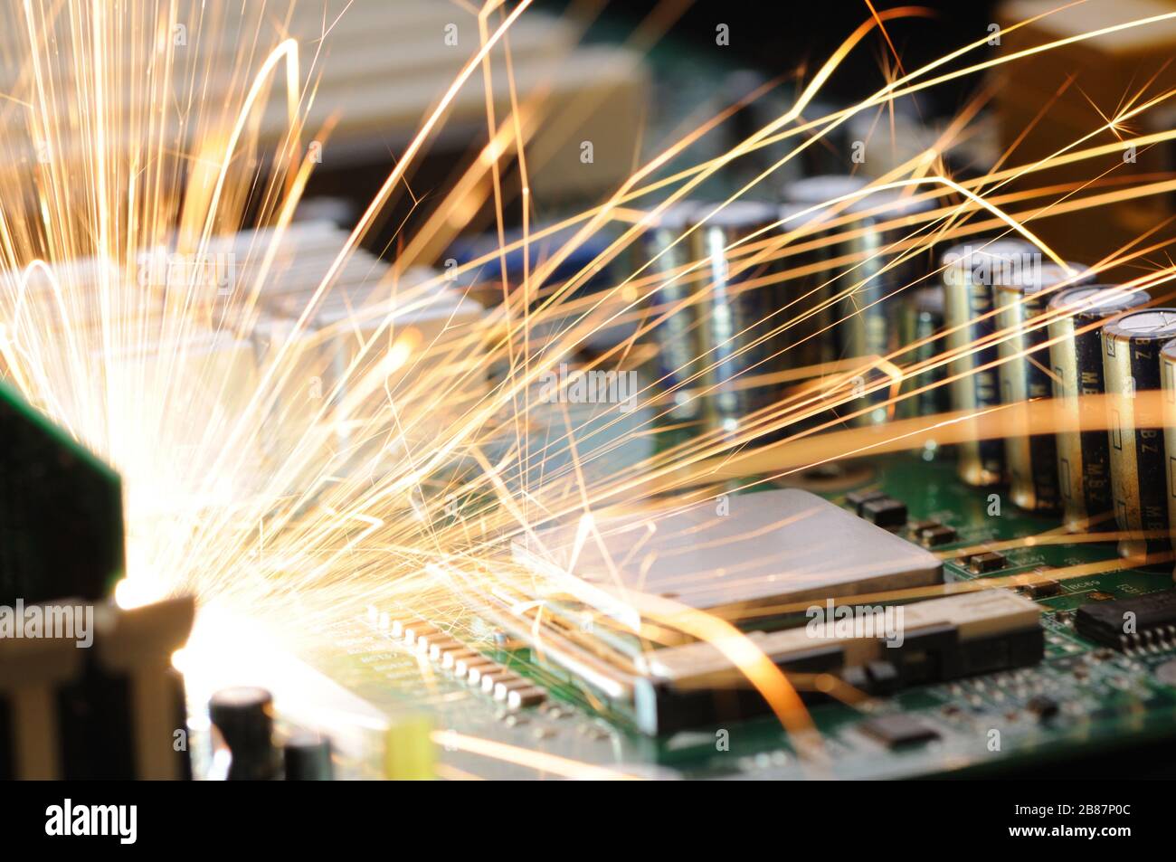 Bright burning sparks fly from the equipment of controller chip. The ...