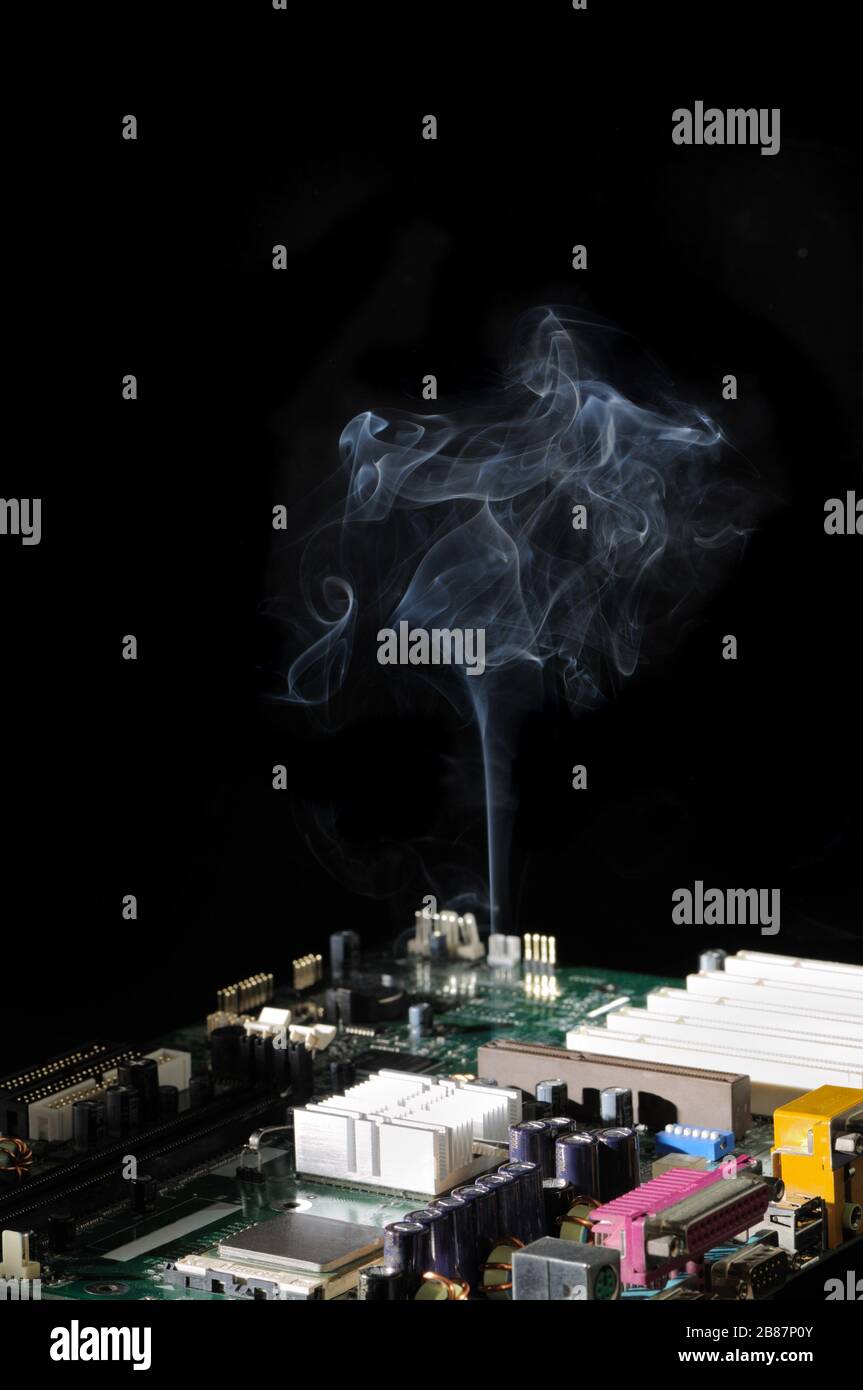 Thin stream of smoke is emitted from a microcircuit consisting in a ...