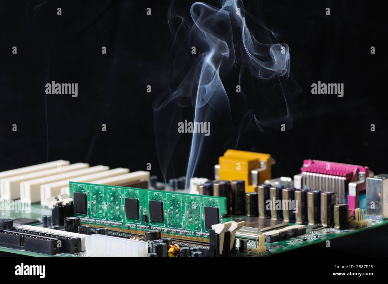 Thin stream of smoke is emitted from a microcircuit consisting in a ...