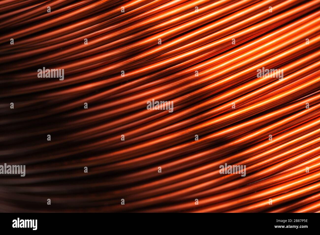 Close-up of a large coil of copper wire in the production of technical ...