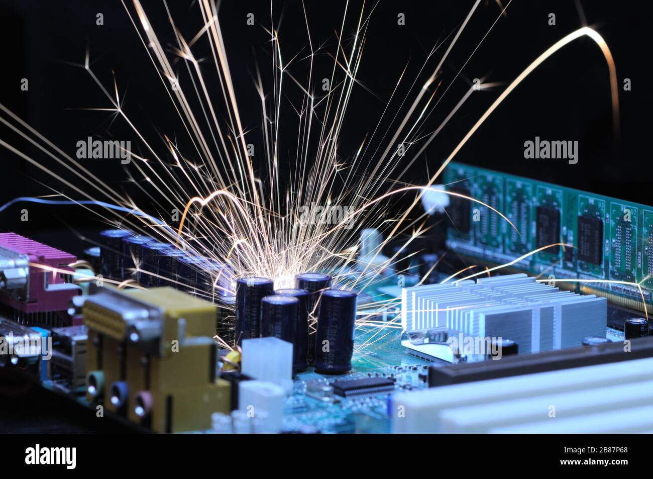 Bright burning sparks fly from the chip of complex electronic equipment ...