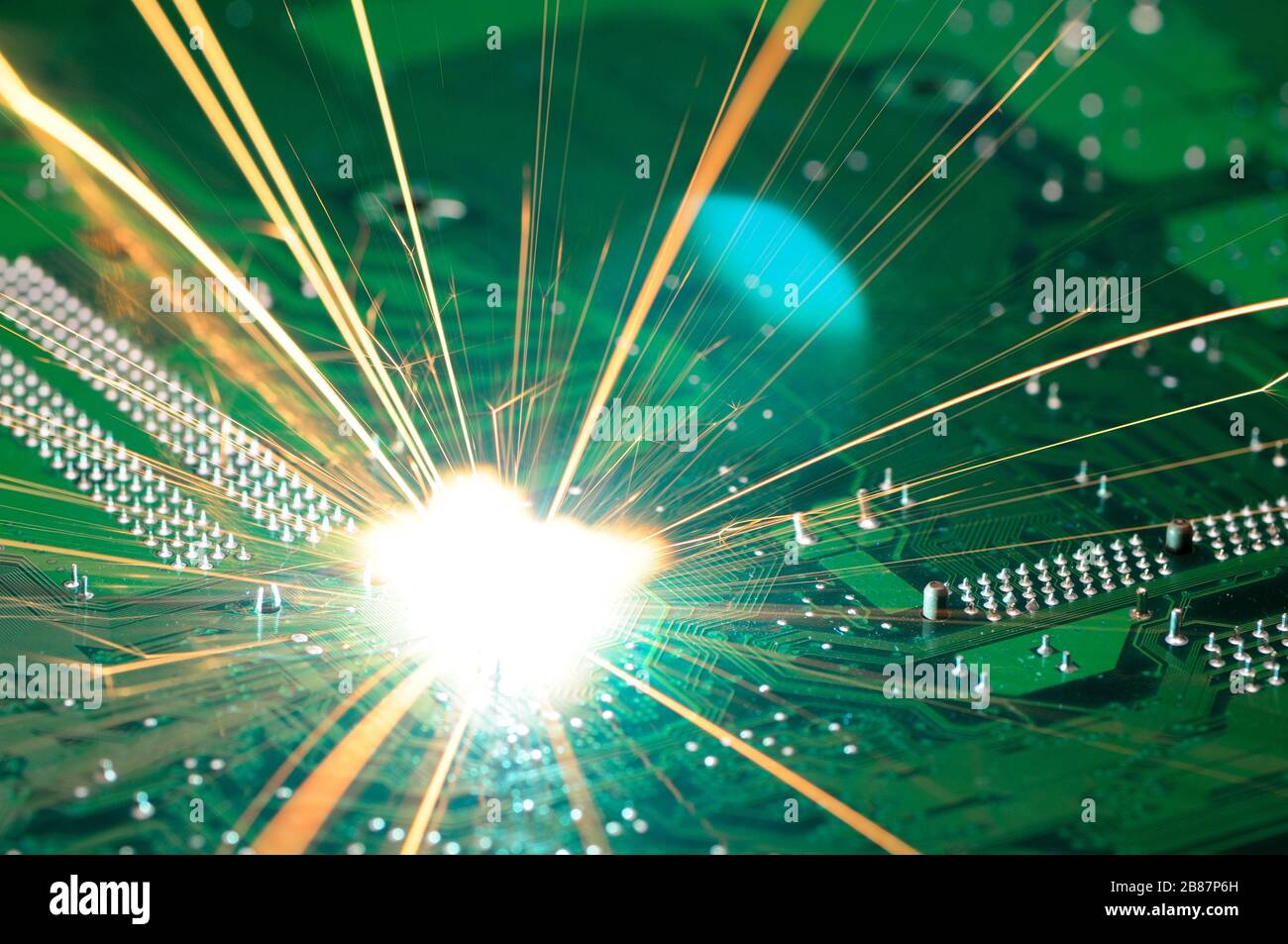 Bright burning sparks fly from the chip of complex electronic equipment ...