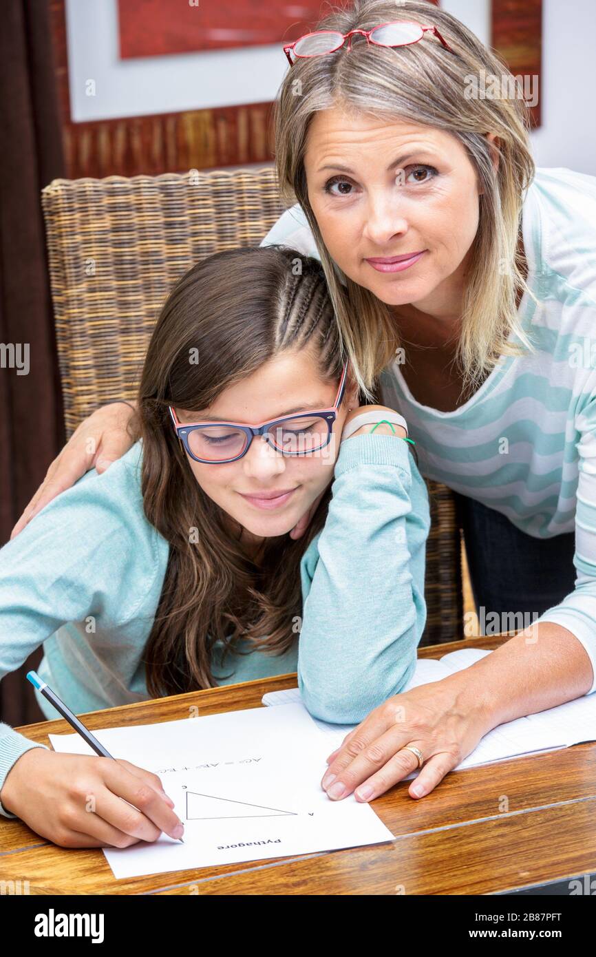 pretty student girl taking tutoring courses on Pythagoras theorem with ...