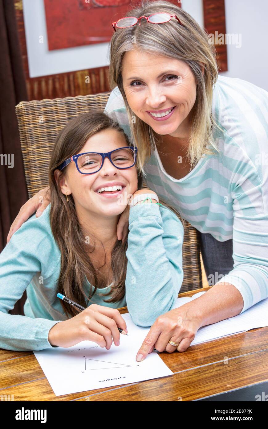 pretty student girl taking mathematics courses on Pythagoras theorem ...