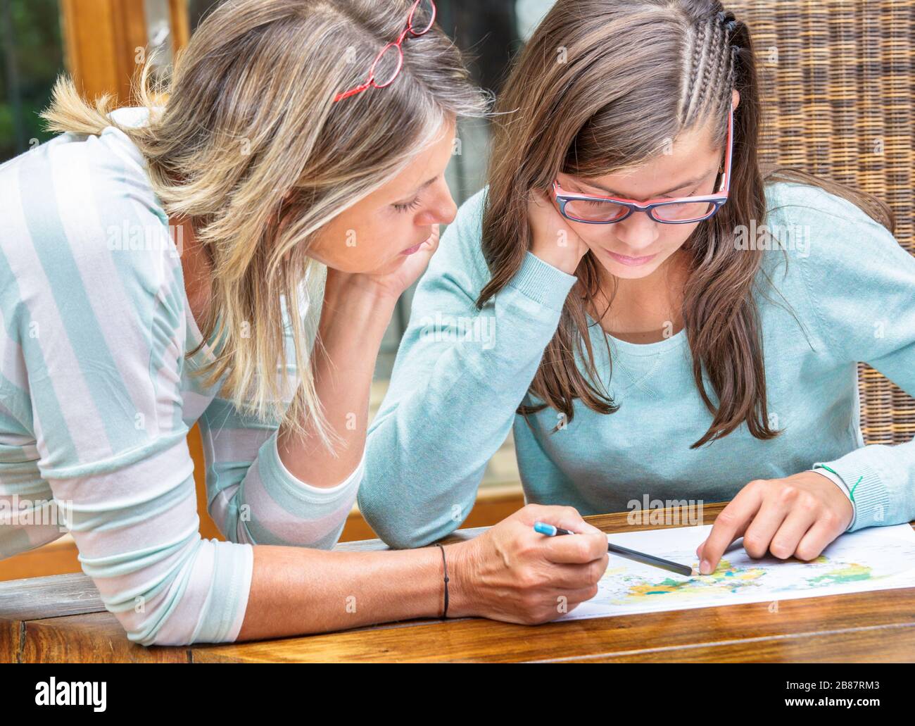 pretty student girl taking courses with beautiful blond teacher Stock ...
