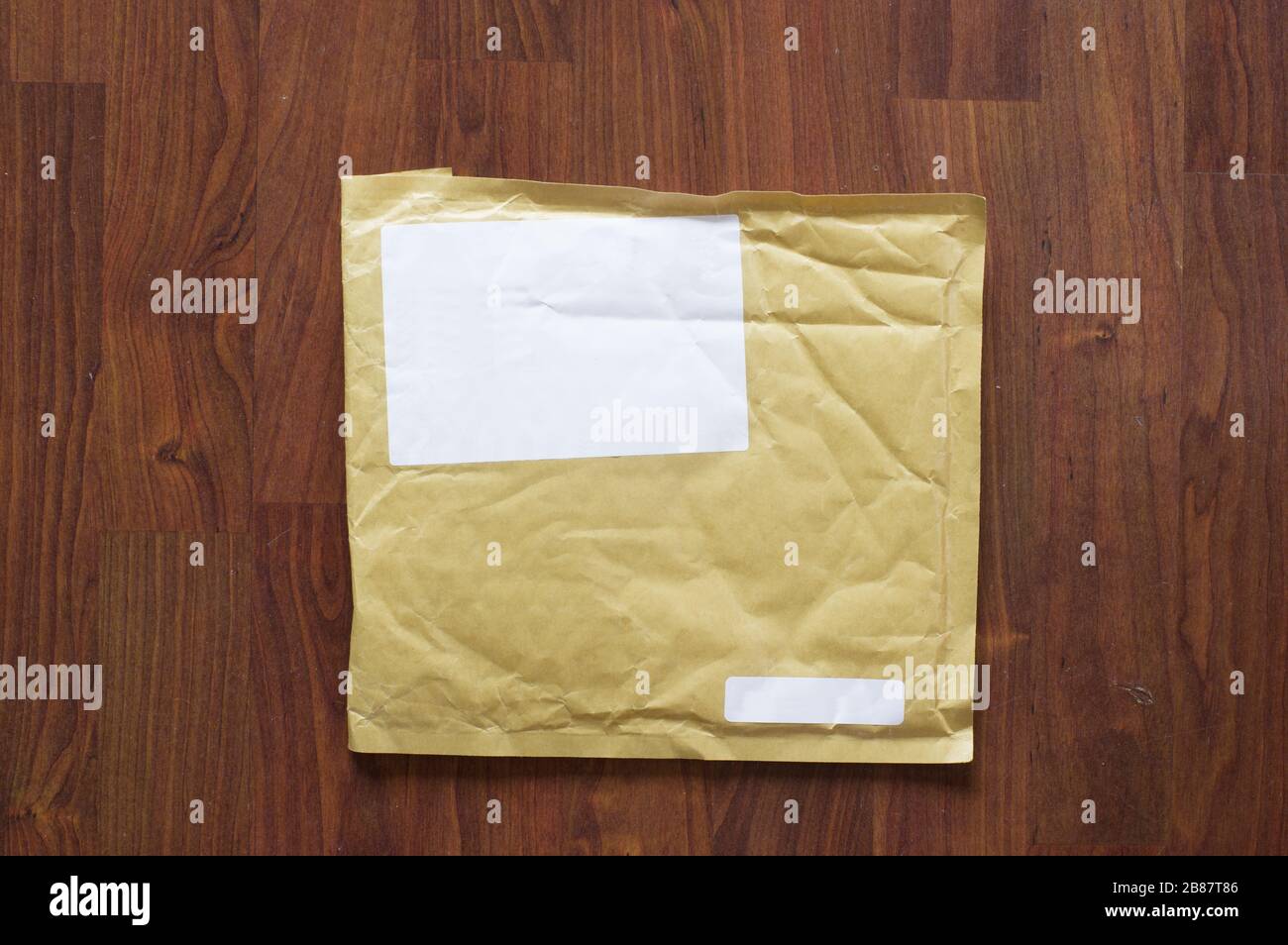 Brown air bubble envelope with empty address sticker Stock Photo - Alamy