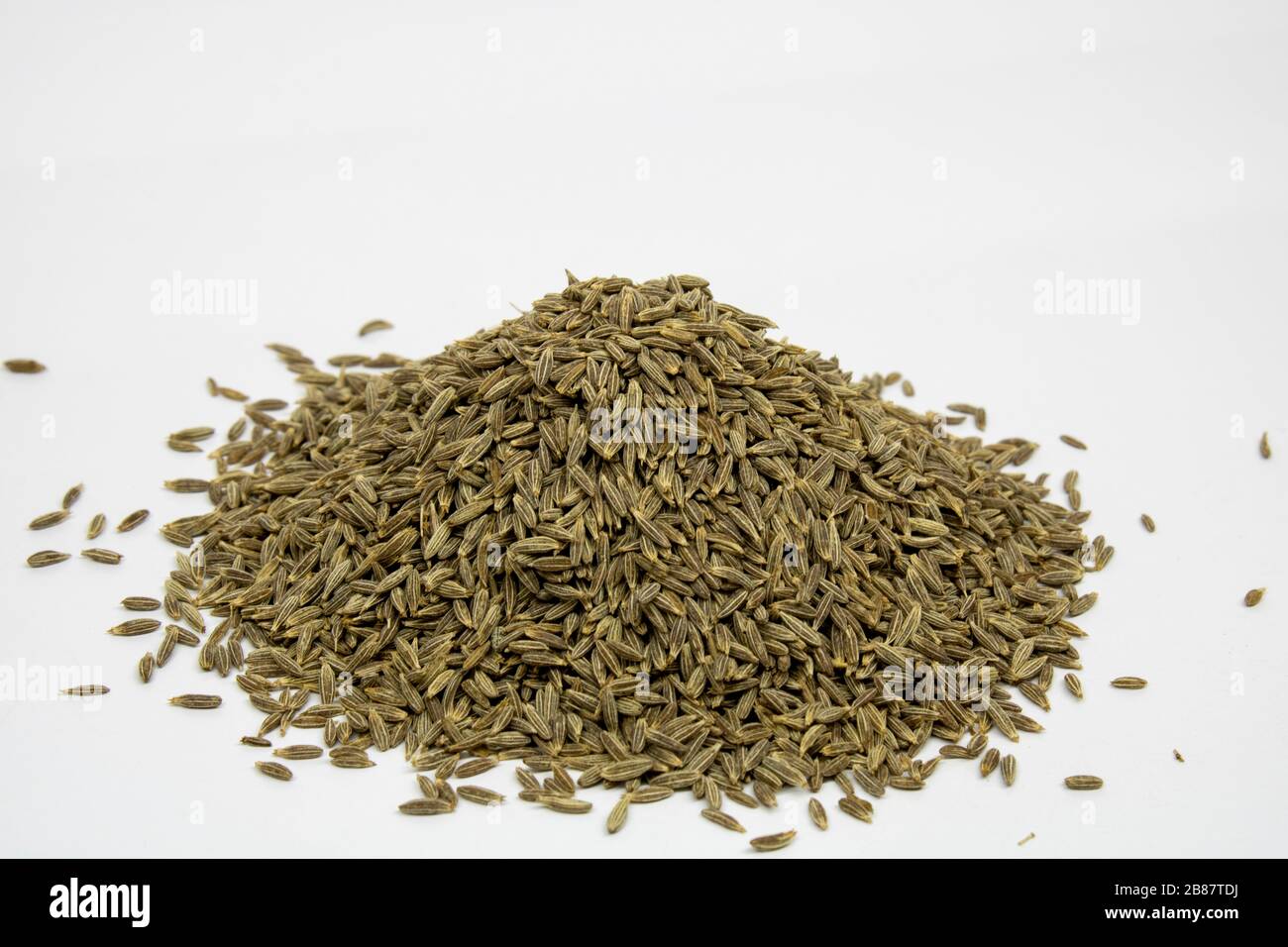 Cumin seeds isolated on white background Stock Photo - Alamy