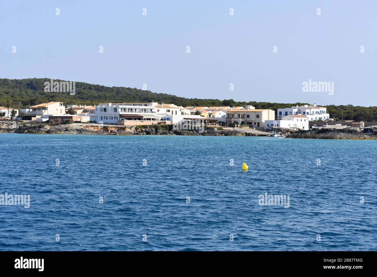 View of the traditional fishing village of Es Calo from the sea ...