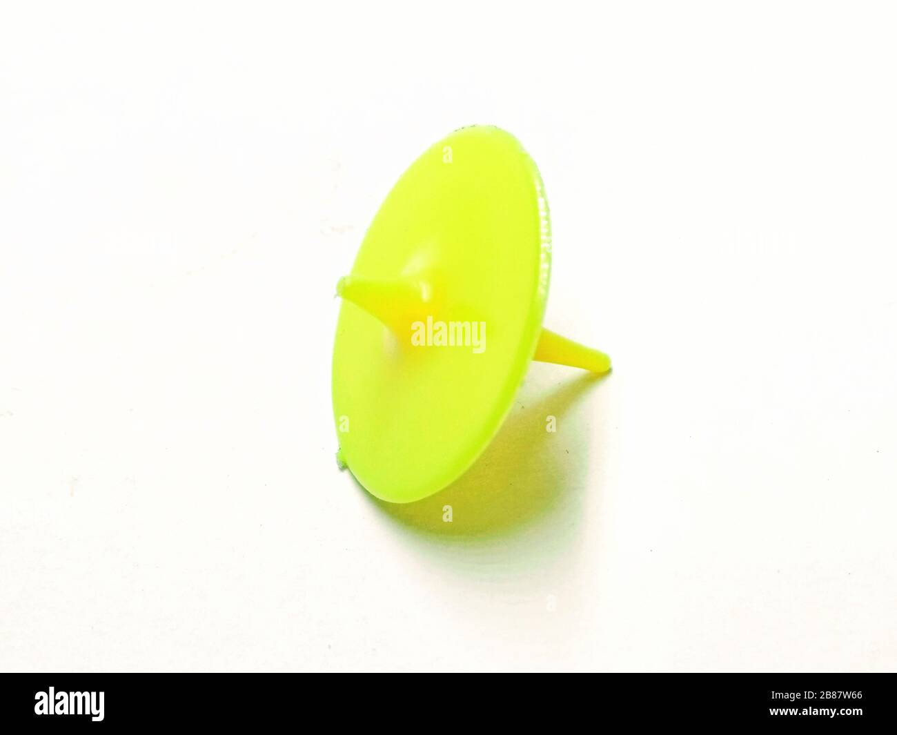 A picture of plastic spinner on white background Stock Photo - Alamy