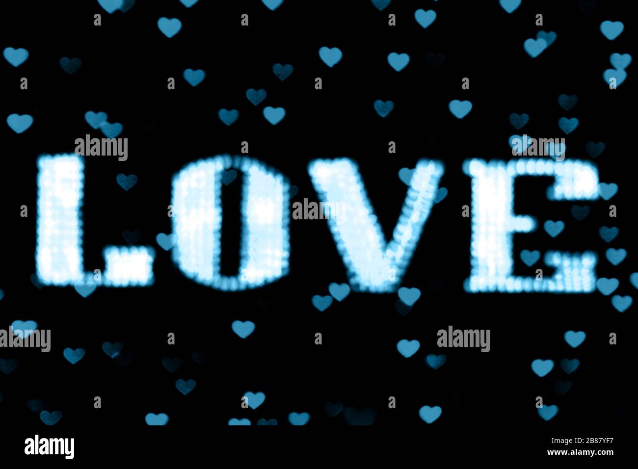 blurred text blue LOVE sign LED Bokeh neon light blue on background ...