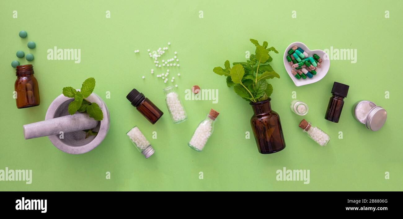 Homeopathy concept. Glass bottles and vials with homeopathic globules ...