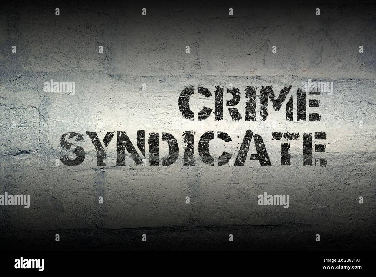 crime syndicate stencil print on the grunge white brick wall Stock ...