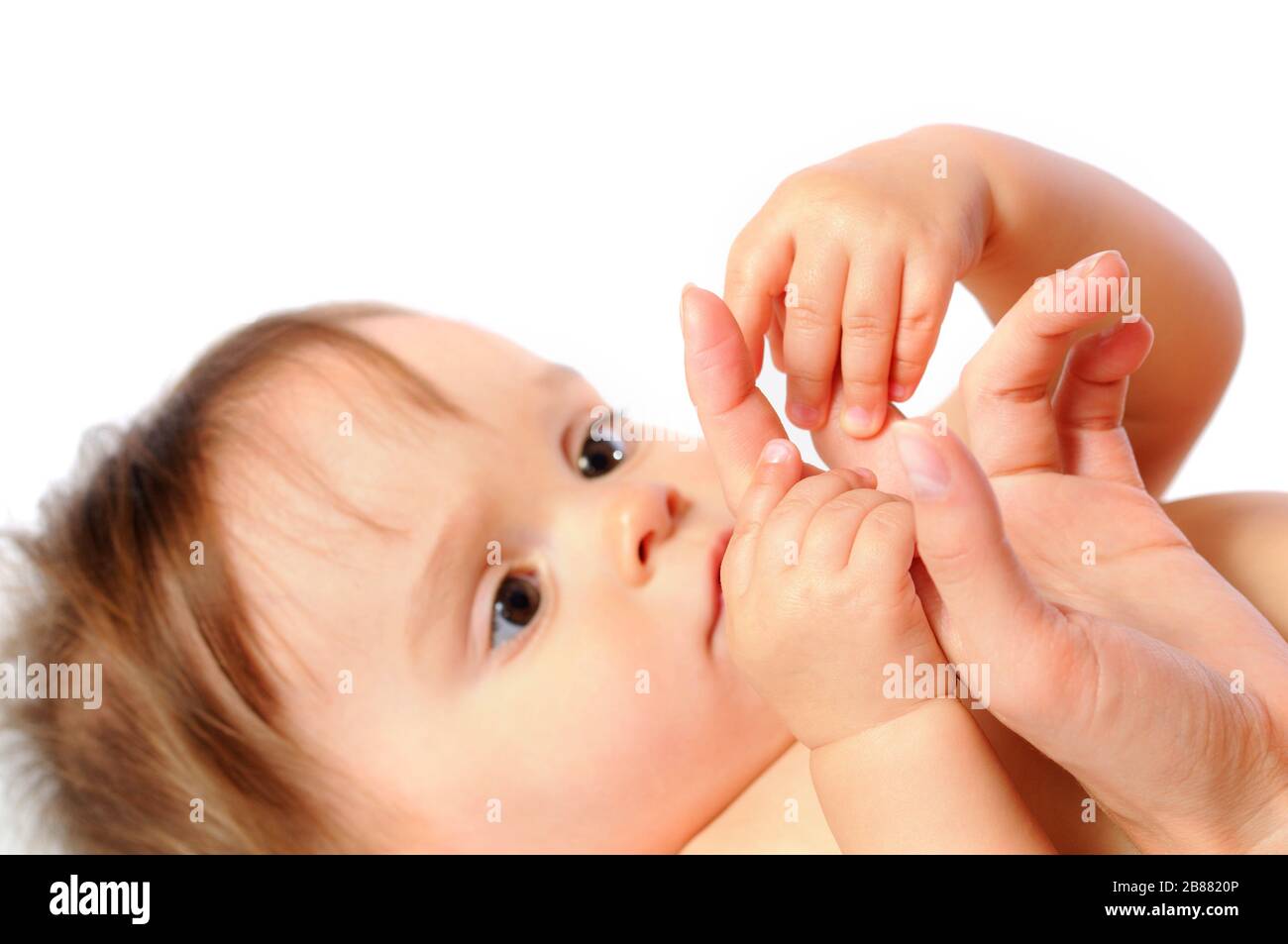 Adorable little child holding palm mother with hands. Parent love ...