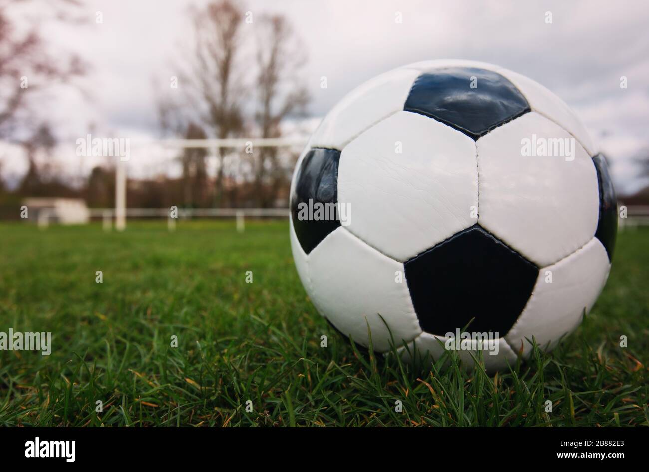Typical soccer ball on the free kick marking line, outdoors on the ...