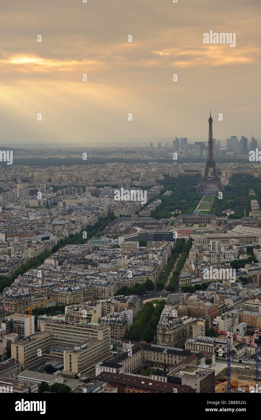 Aerial view of Paris, France. Eiffel tower in overcast sky with light ...