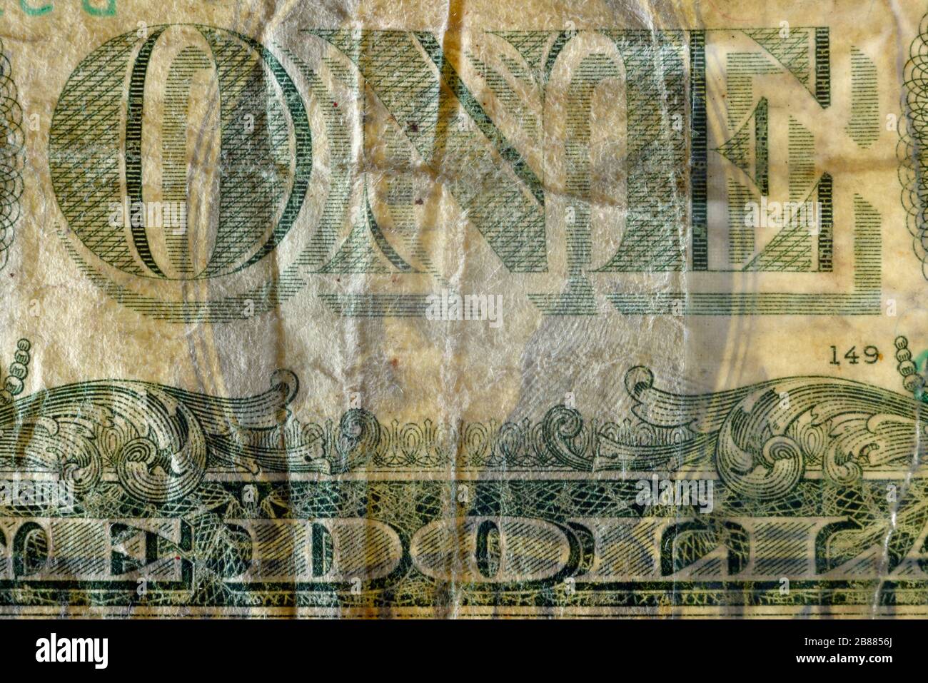 ONE text, highly magnified surface of used 1 dollar banknote with ...