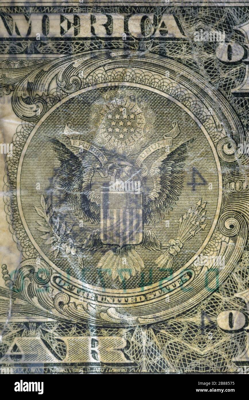 The Eagle ensign, highly magnified surface of used 1 dollar banknote ...