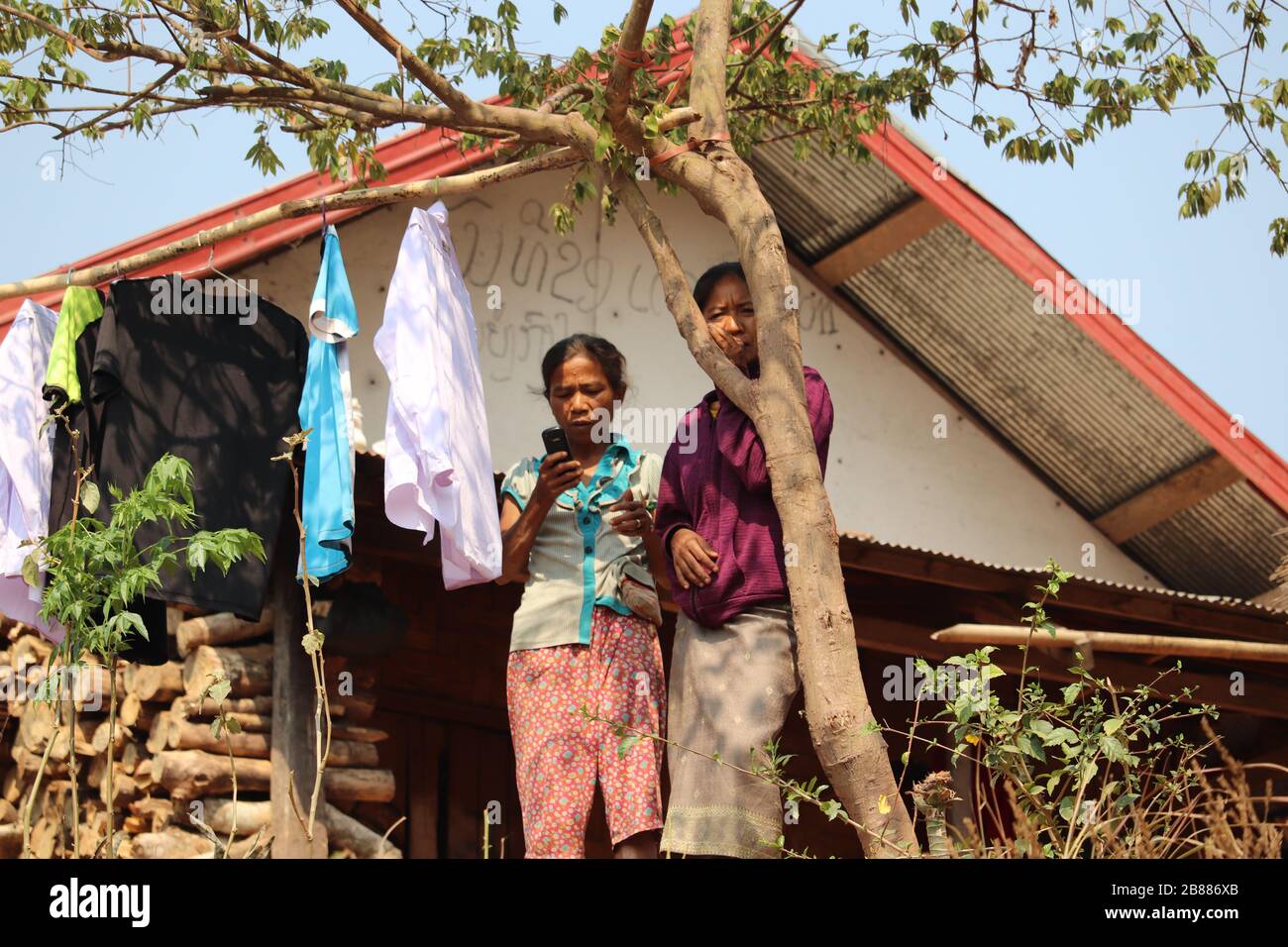 MEN AND WOMEN IN A TRIBAL VILLAGE IN LUANG NAMTHA PROVINCE,NORTHERN ...