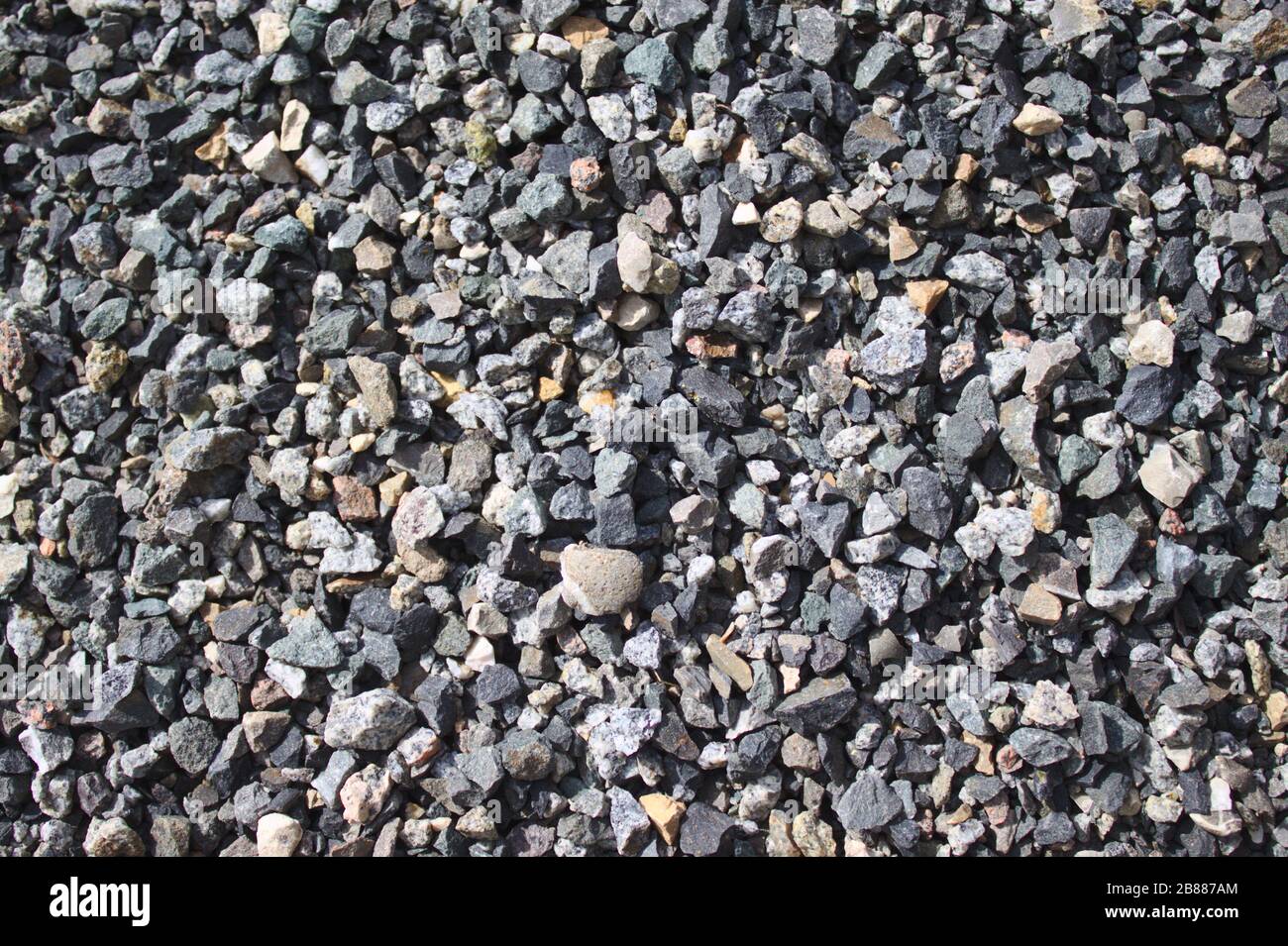 The picture shows a background with little grey stones Stock Photo - Alamy