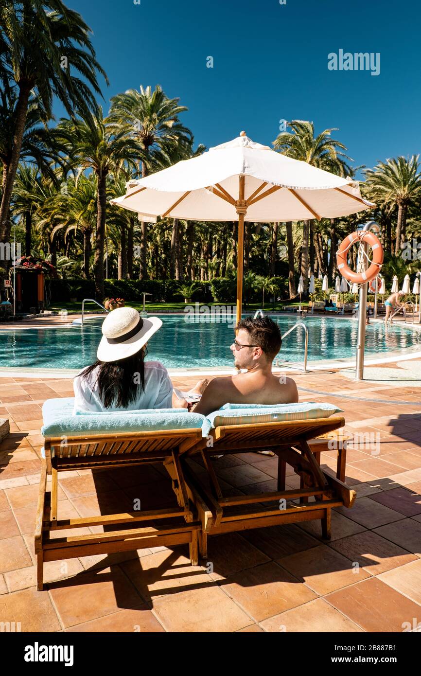 Pool lounge chair woman relaxing hi-res stock photography and images ...