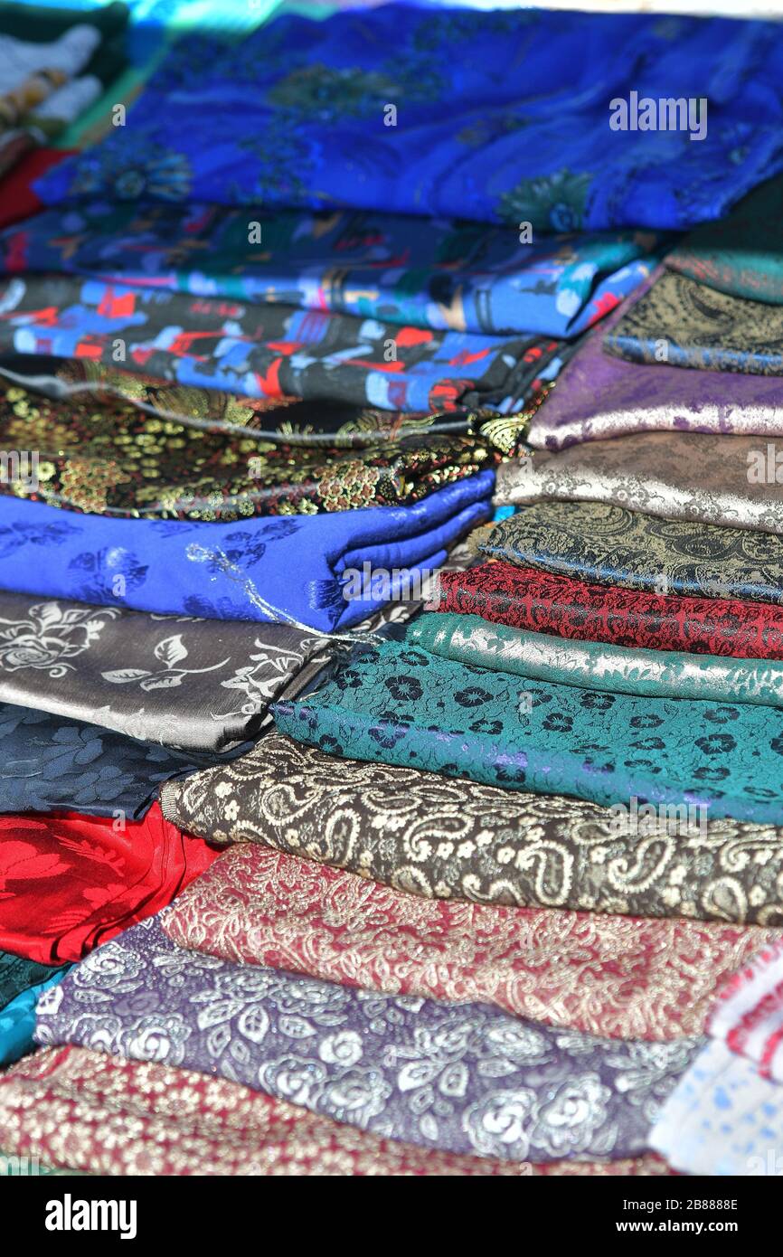 Traditional turkmen fabric lying in rows in the market Stock Photo - Alamy