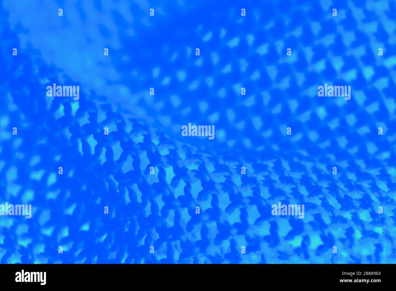 Vivid blue fabric mesh textile background, knitting background texture ...