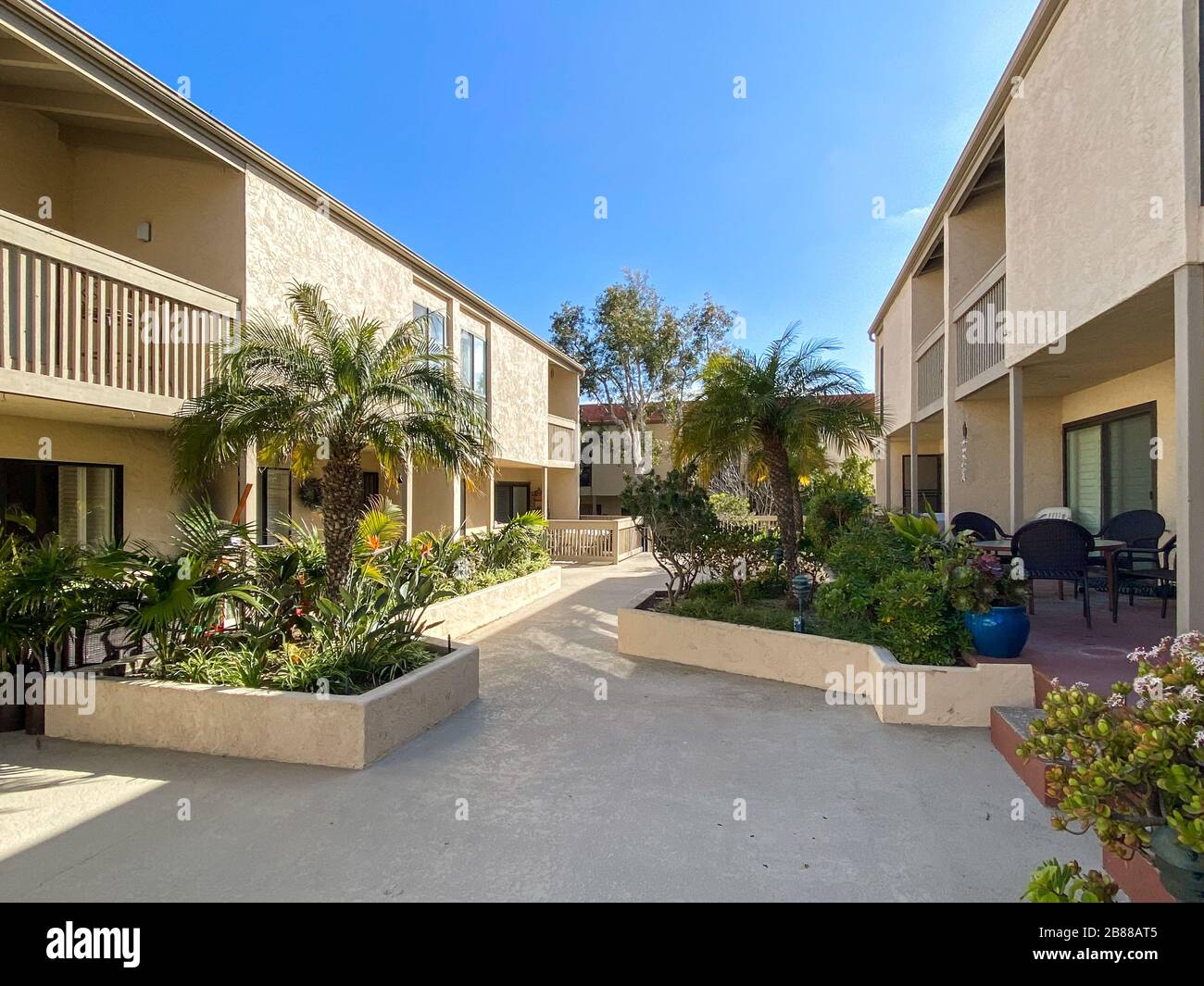 Garden and lawn along the walk path through the typical condo complex ...