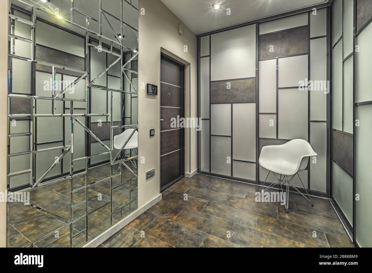 Empty residential house entrance with closed doors build in closets ...