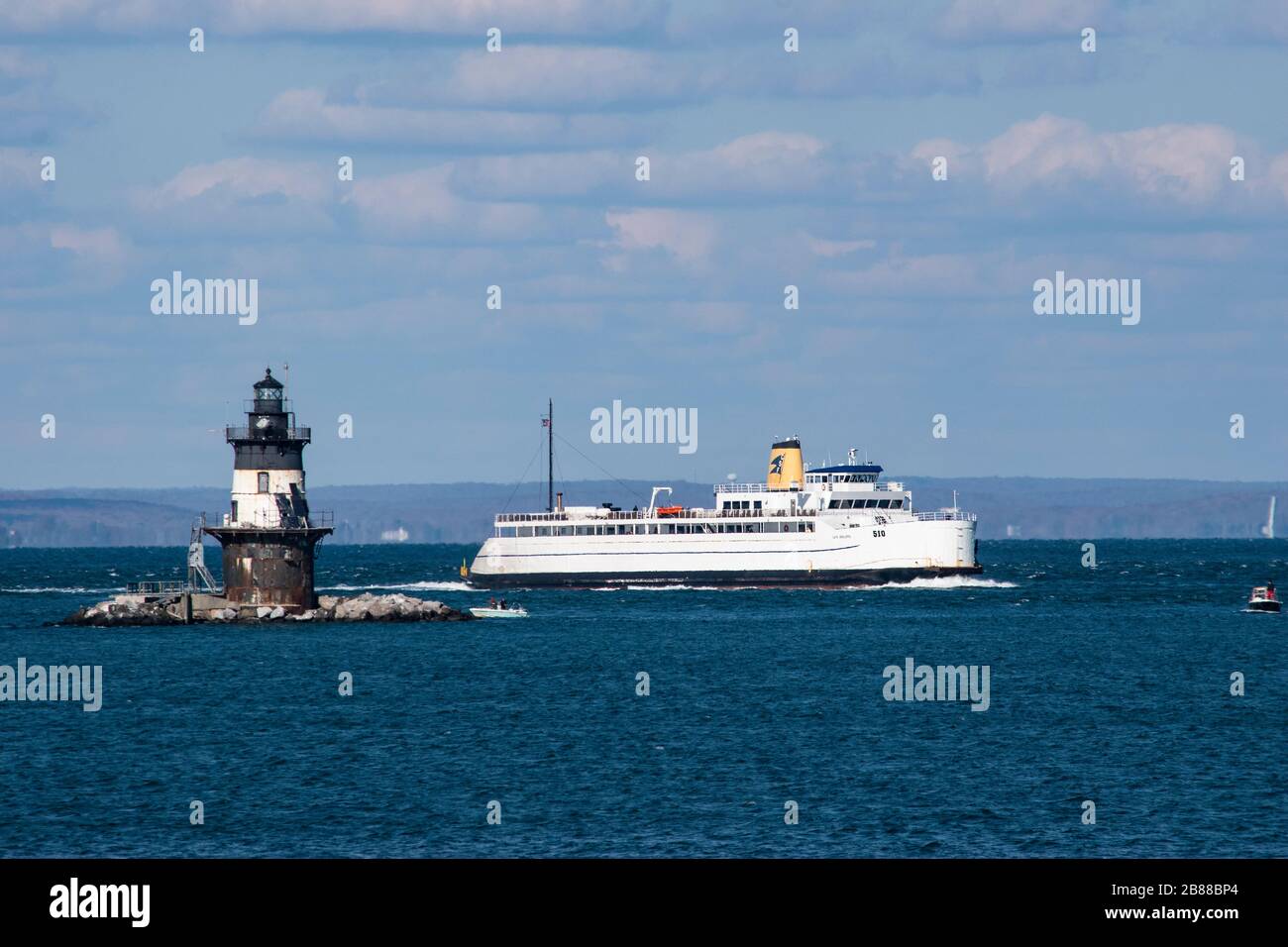 Ferry and Lighthouse Stock Photo - Alamy