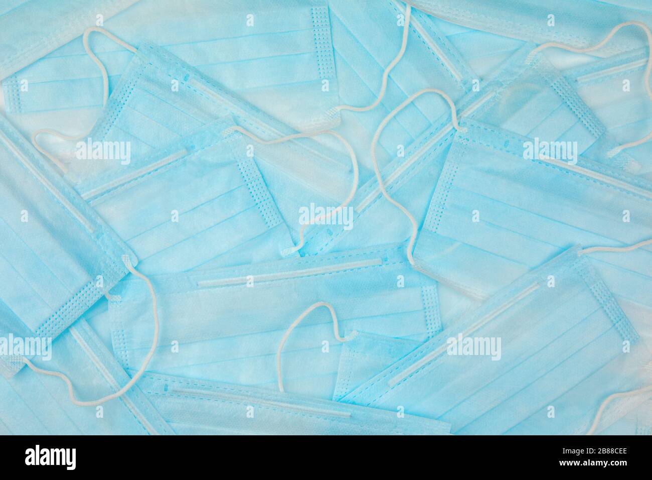 blue surgical medical masks as background texture Stock Photo - Alamy