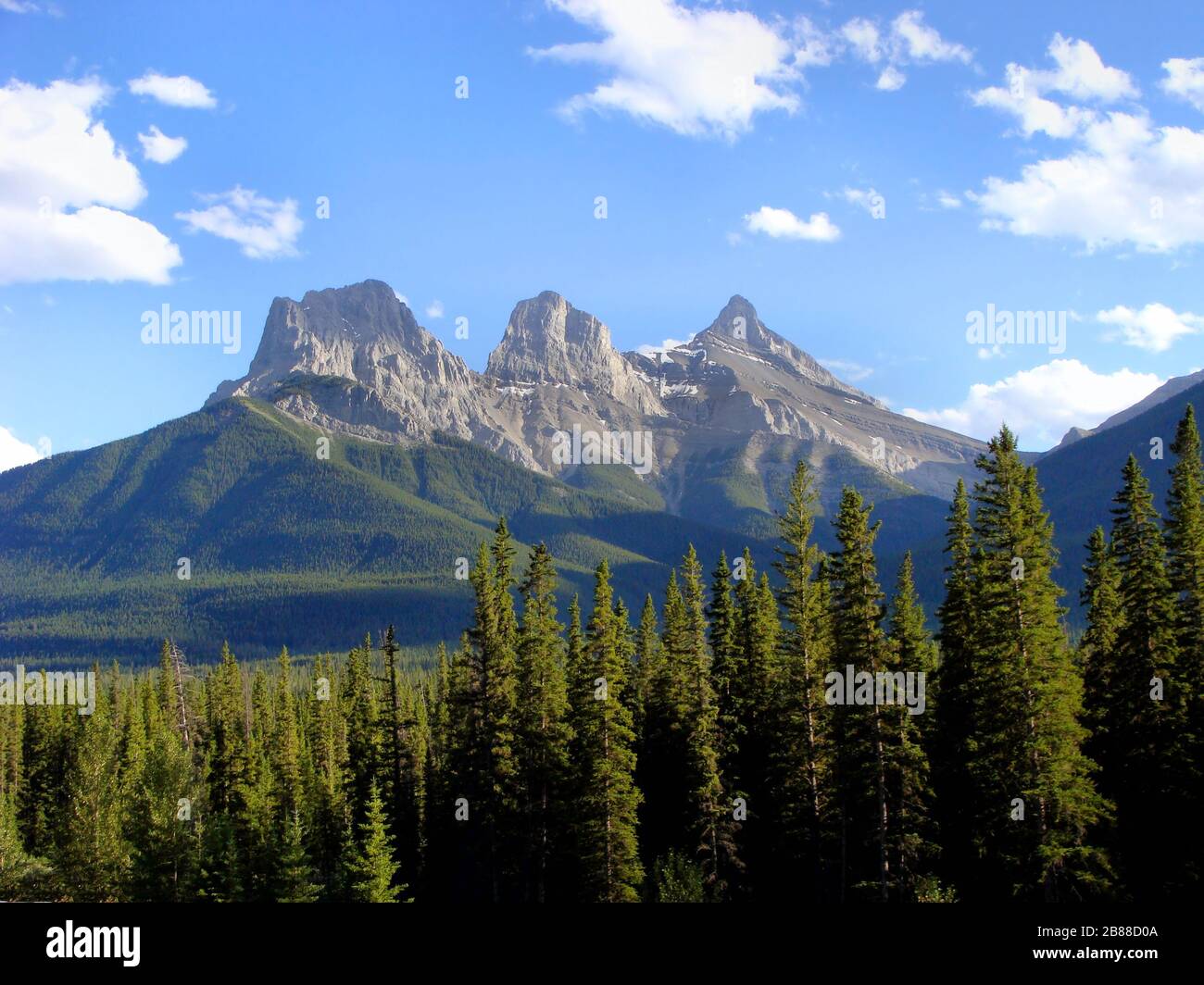 Three Sisters mountain peaks near Canmore, Alberta, Canada Stock Photo ...