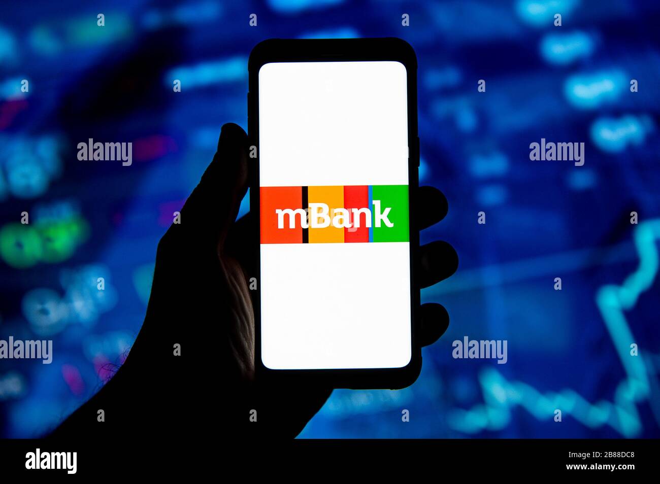 In this photo illustration a mBank logo seen displayed on a smartphone ...