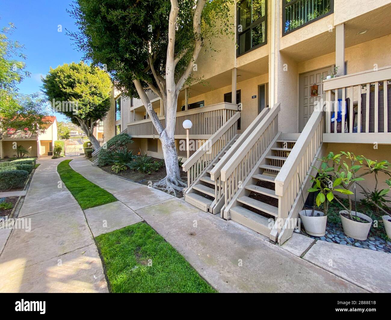 Garden and lawn along the walk path through the typical condo complex ...