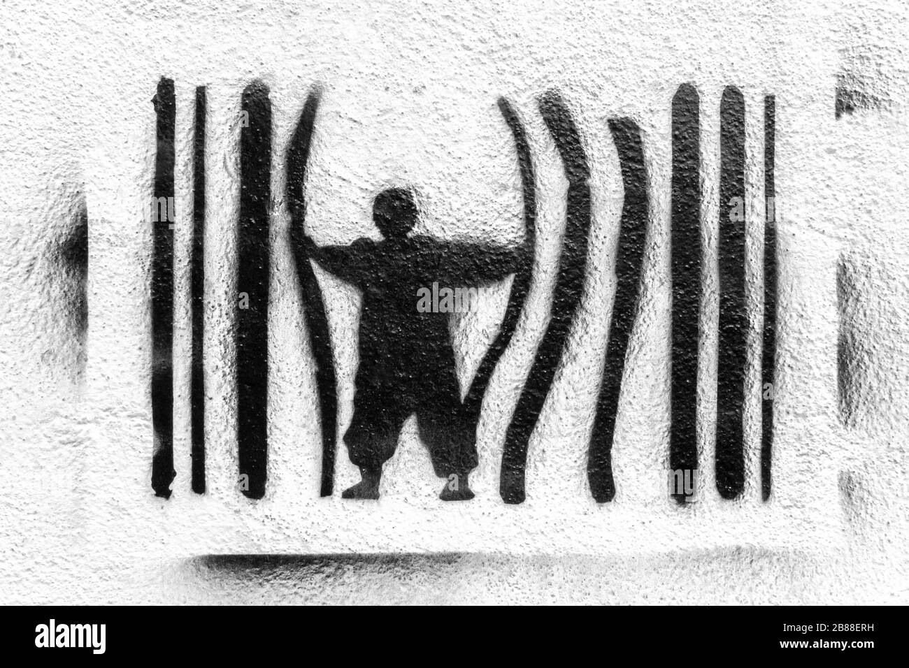 Graffiti depicting a man escaping from prison. Concept of escape ...
