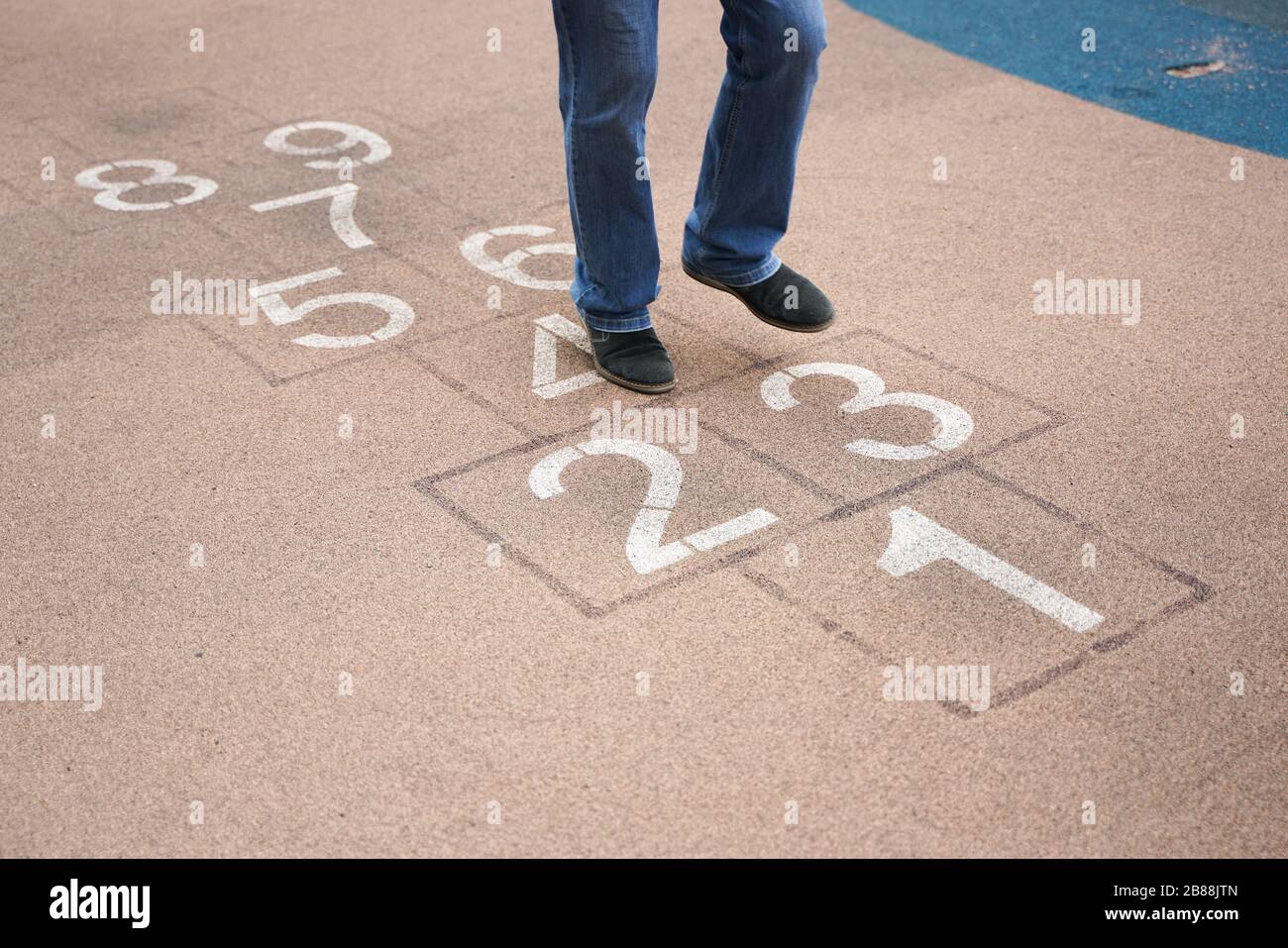 kid playing hopscotch on playground outdoors, children outdoor ...