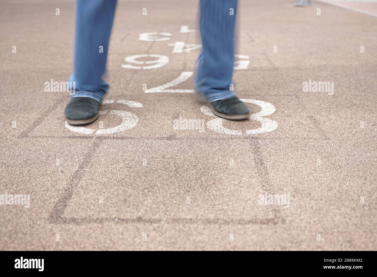 kid playing hopscotch on playground outdoors, children outdoor ...