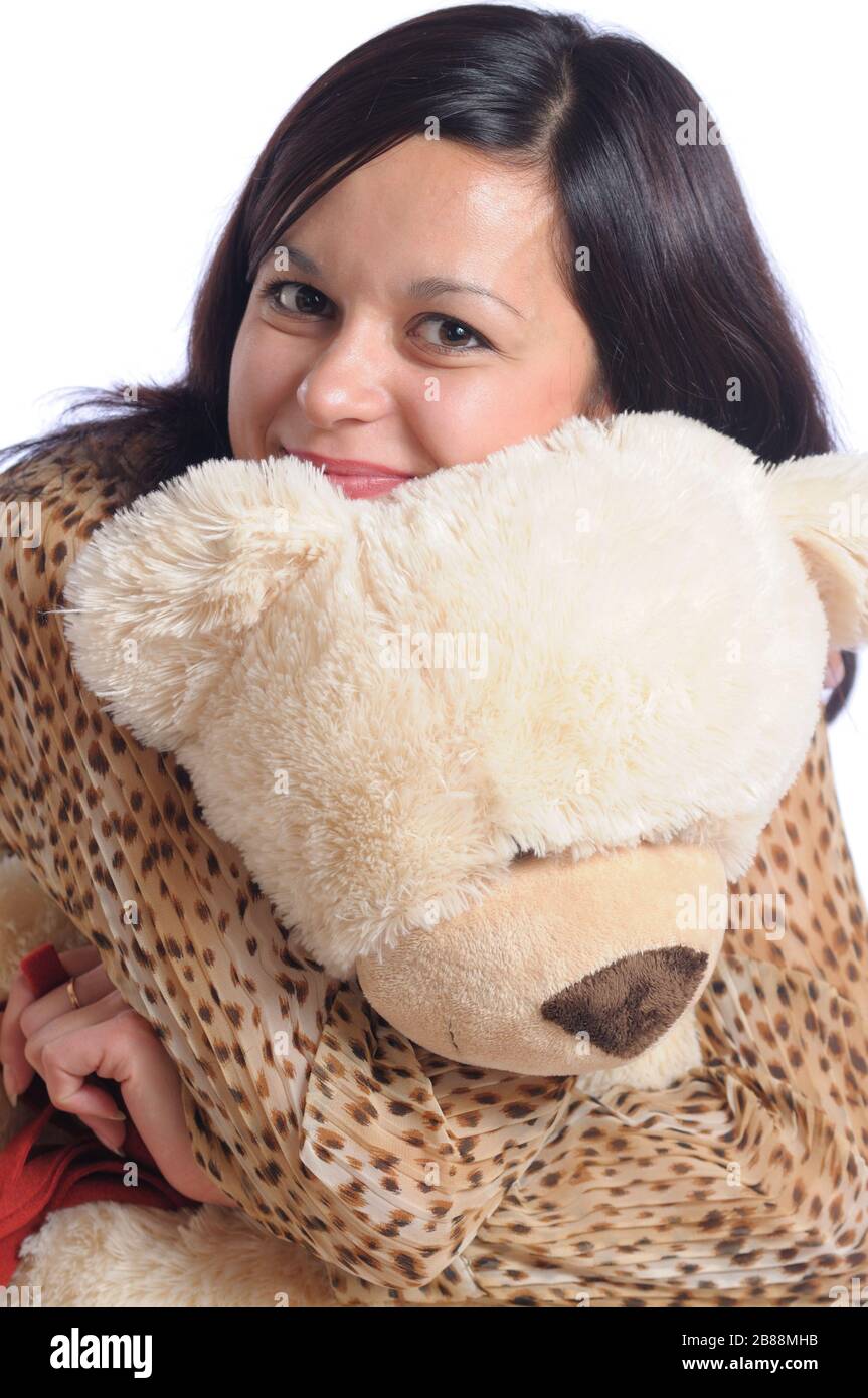 Portrait of pretty european brunette woman with teddy. Attractive girl ...