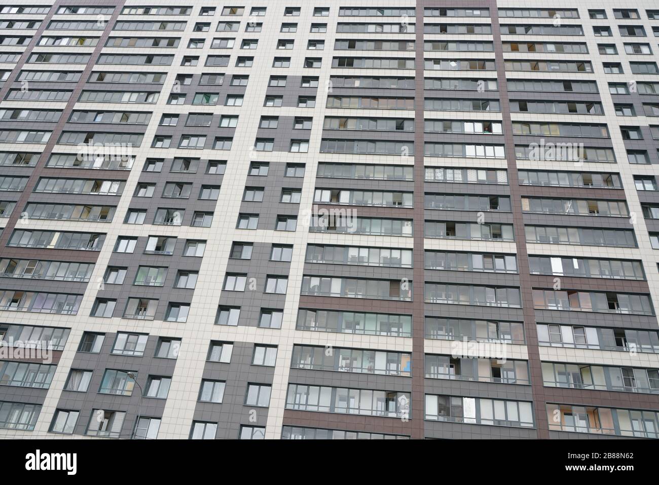 Frontal view of facade of building with a lot of windows. modern city ...