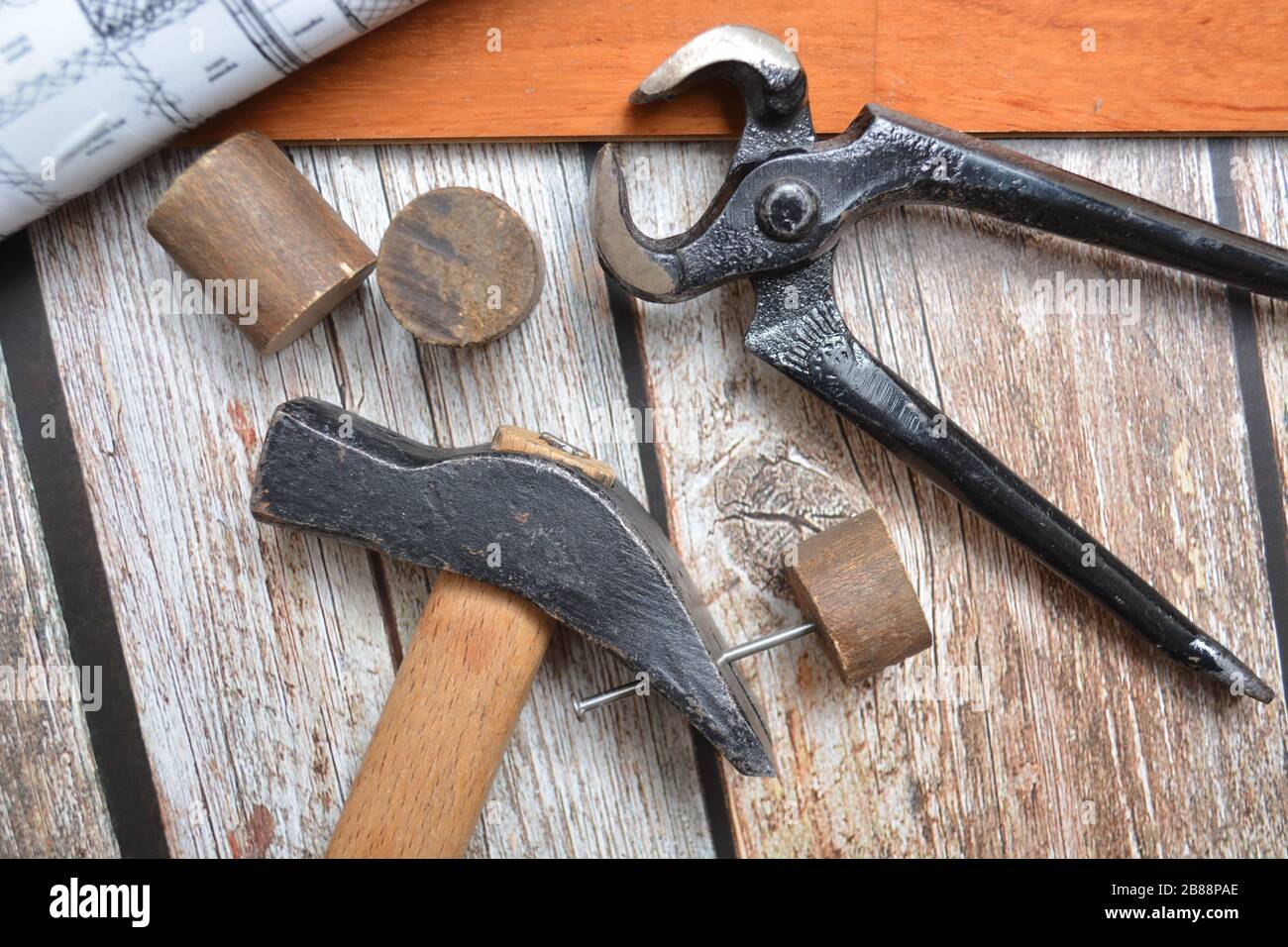 carpenter work tools hammer nail pincer wood Stock Photo - Alamy